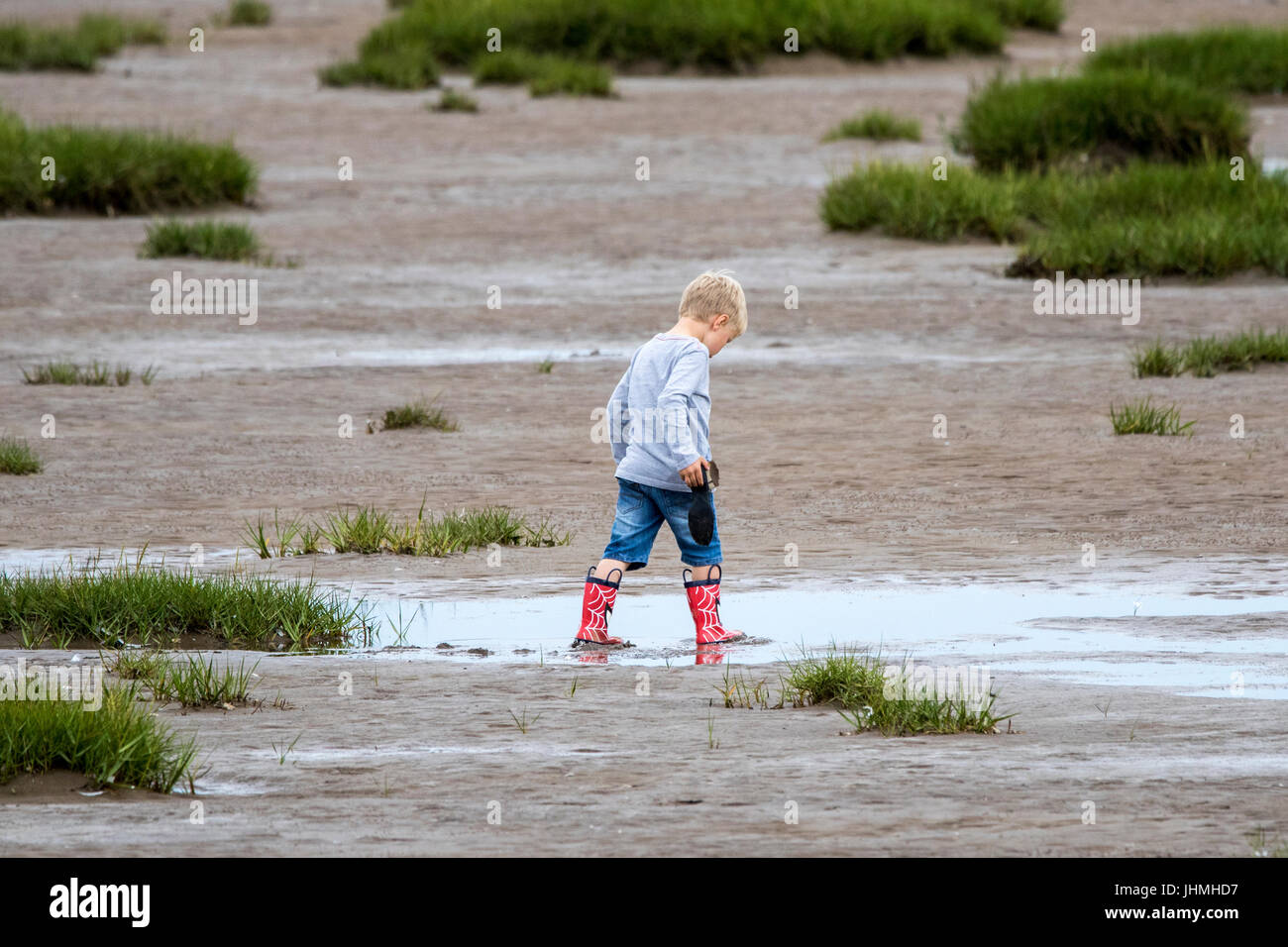 Toddler jumping puddles hi-res stock photography and images - Alamy