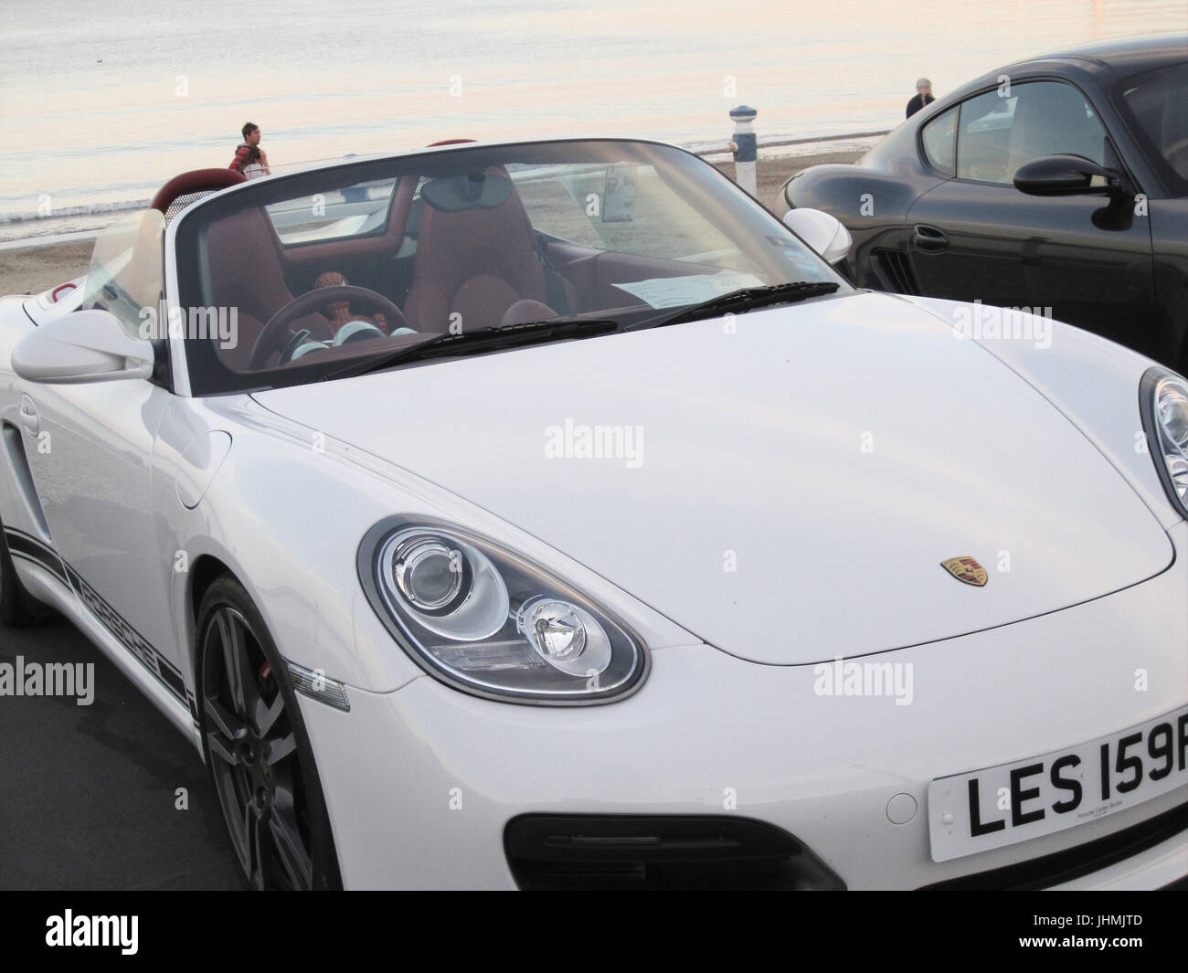 Dorset, UK. 14th July, 2017. Porsche owners exhibit their cars along ...