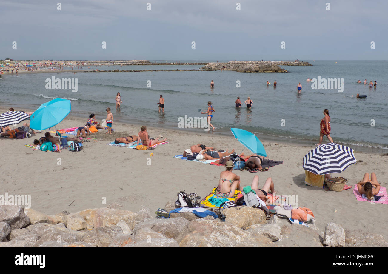 Tourists and local residents at the beach of St. Marie de la Mer near ...