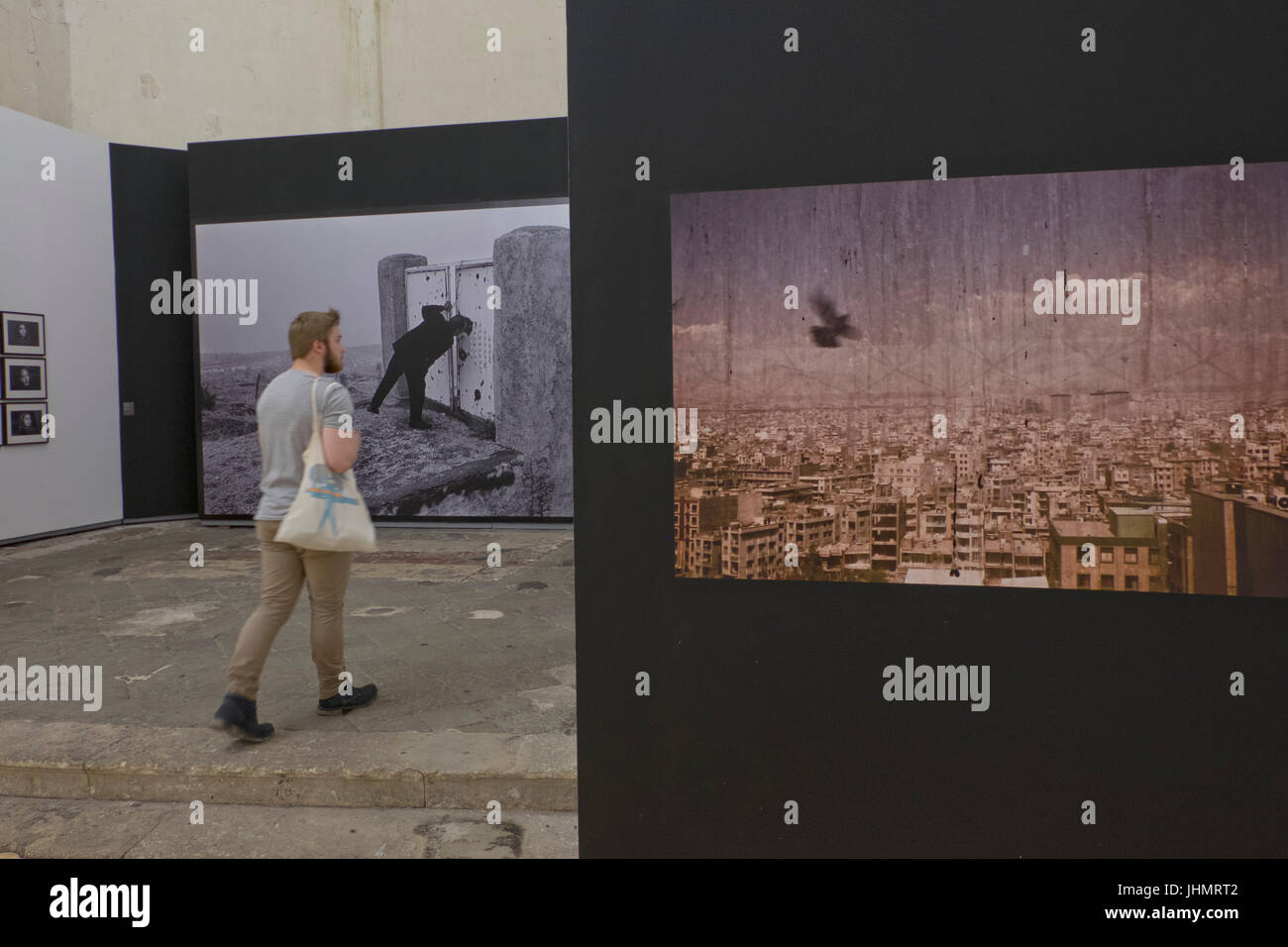 Visitor to an exhibition at the Rencontres d'Arles famous annual ...