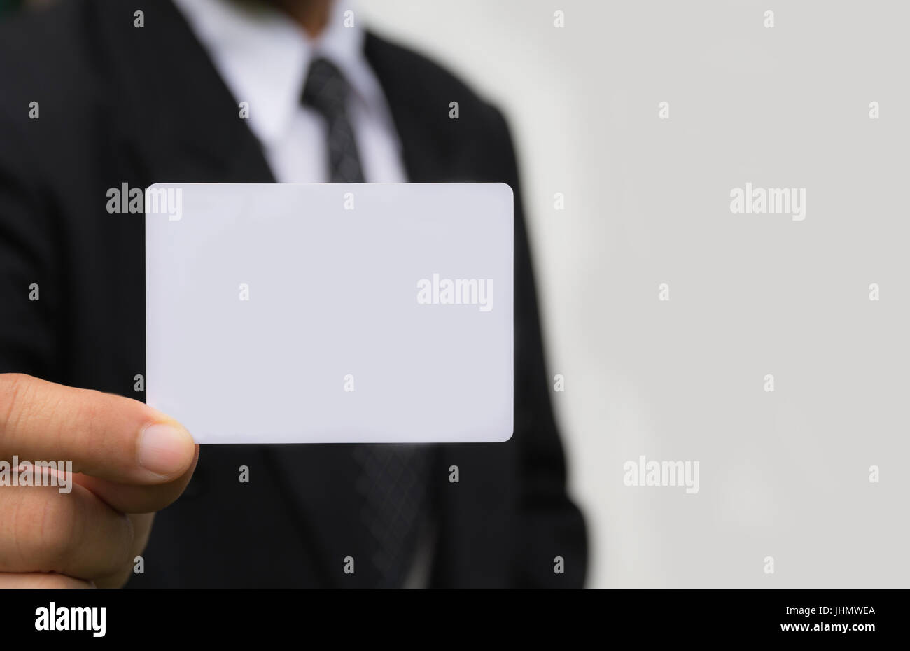 Hand of businessman holding the white card on white background Stock ...