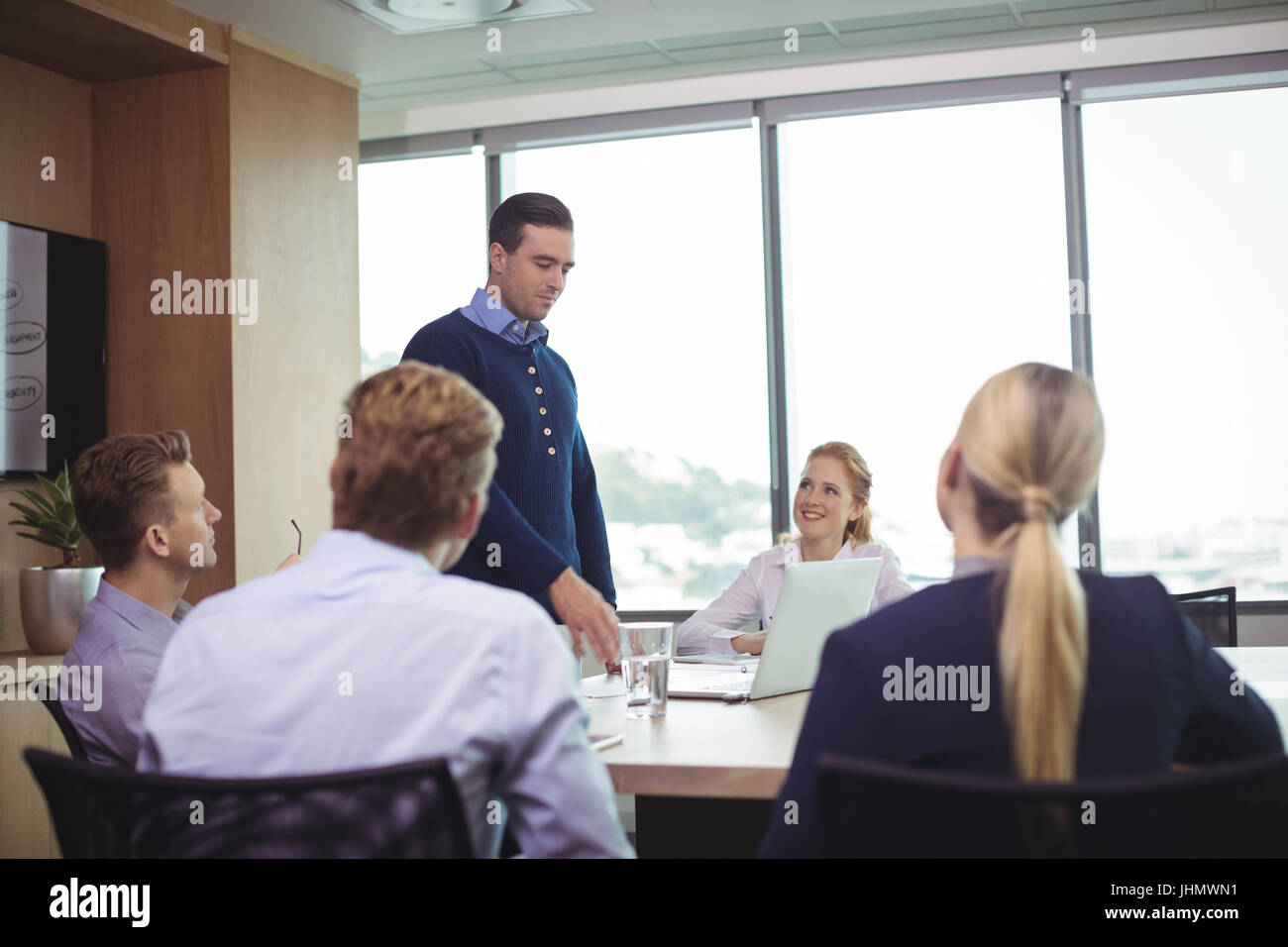 Business people discussing during meeting in board room Stock Photo - Alamy