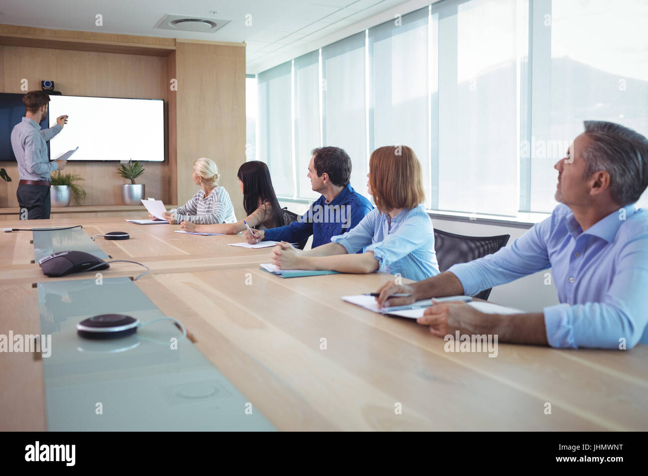 Business people at conference table during meeting in board room Stock ...