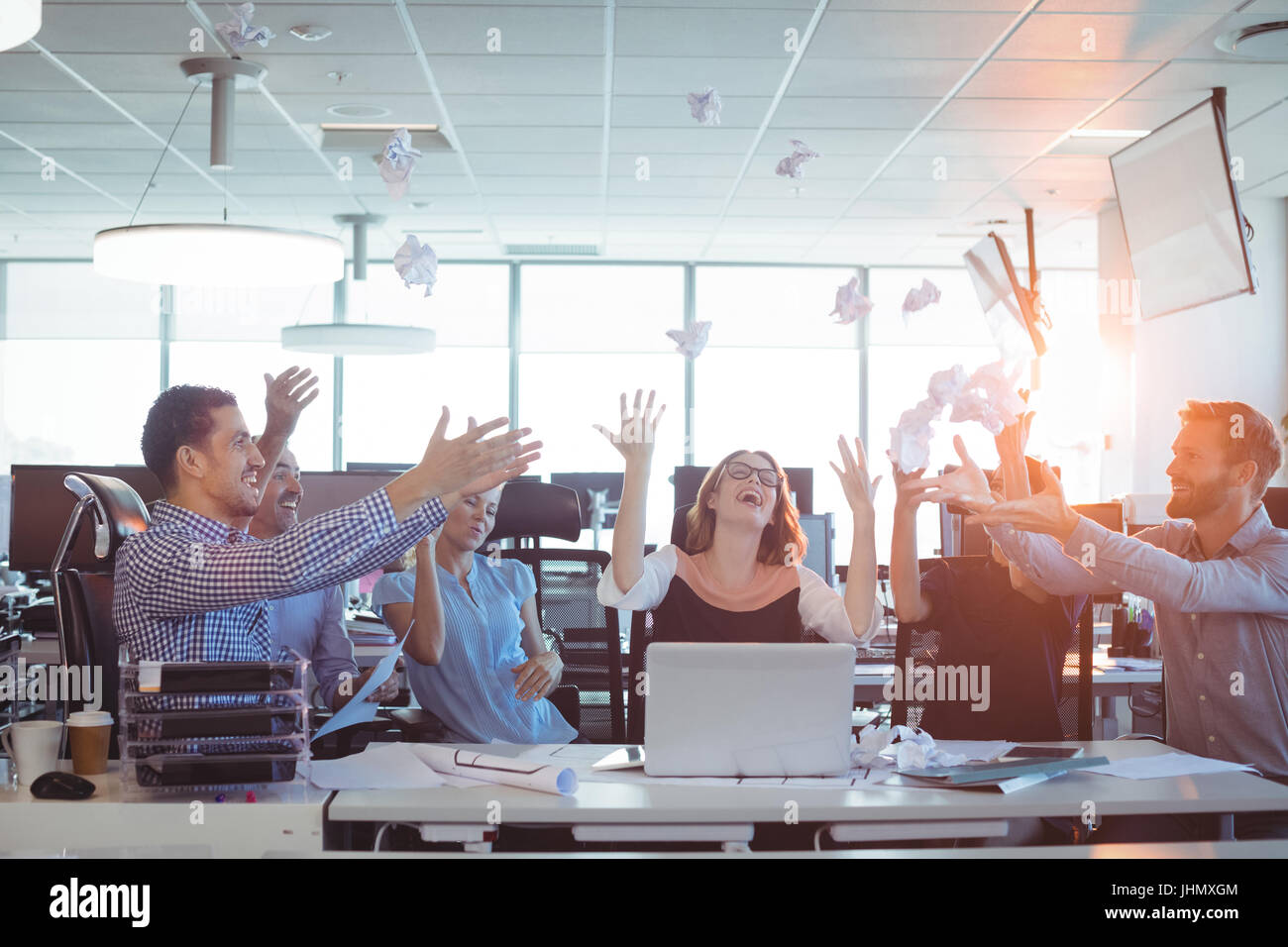 Man in chair tossing paper hi-res stock photography and images - Alamy