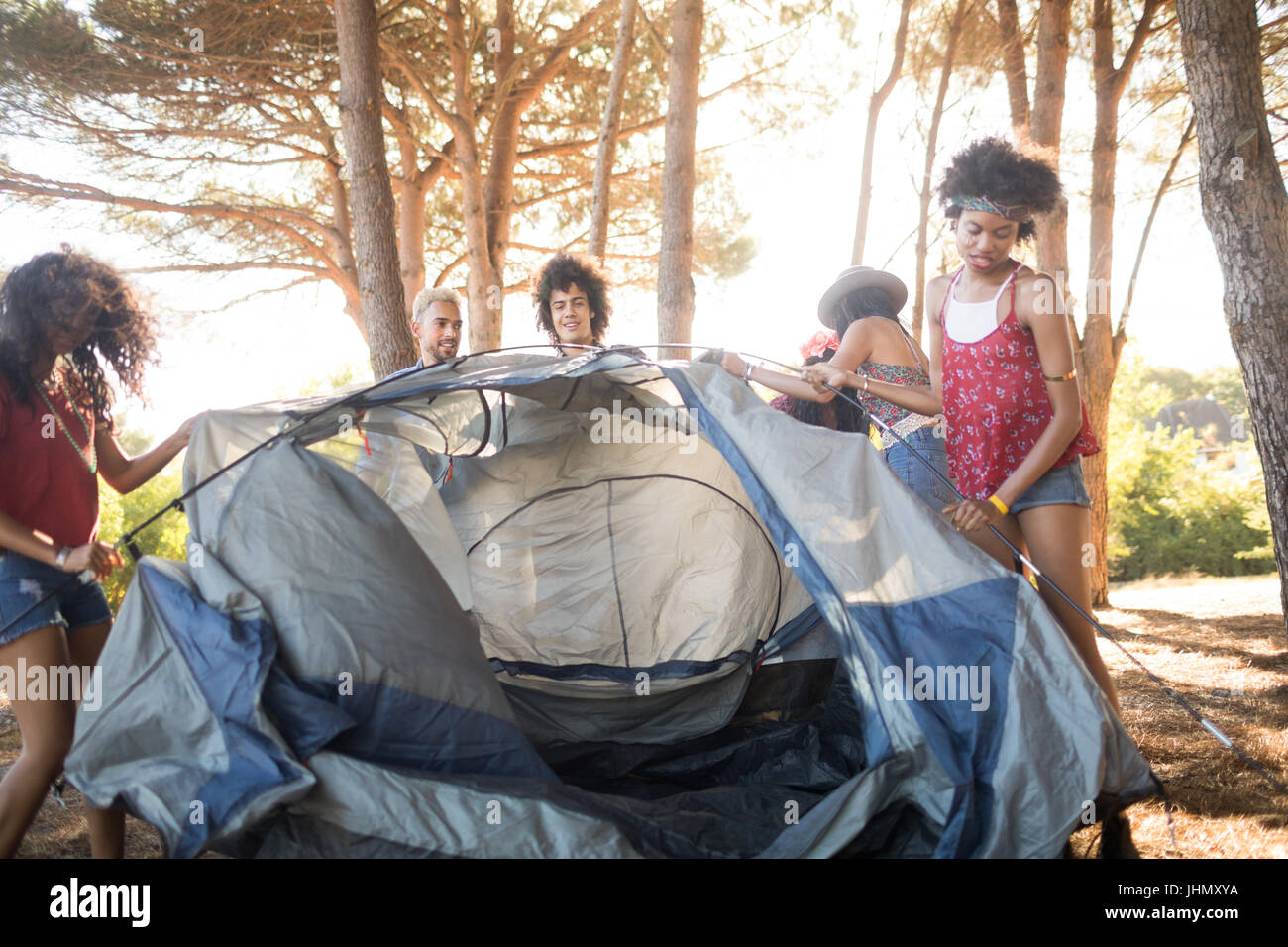 Friends setting up a tent hi-res stock photography and images - Alamy