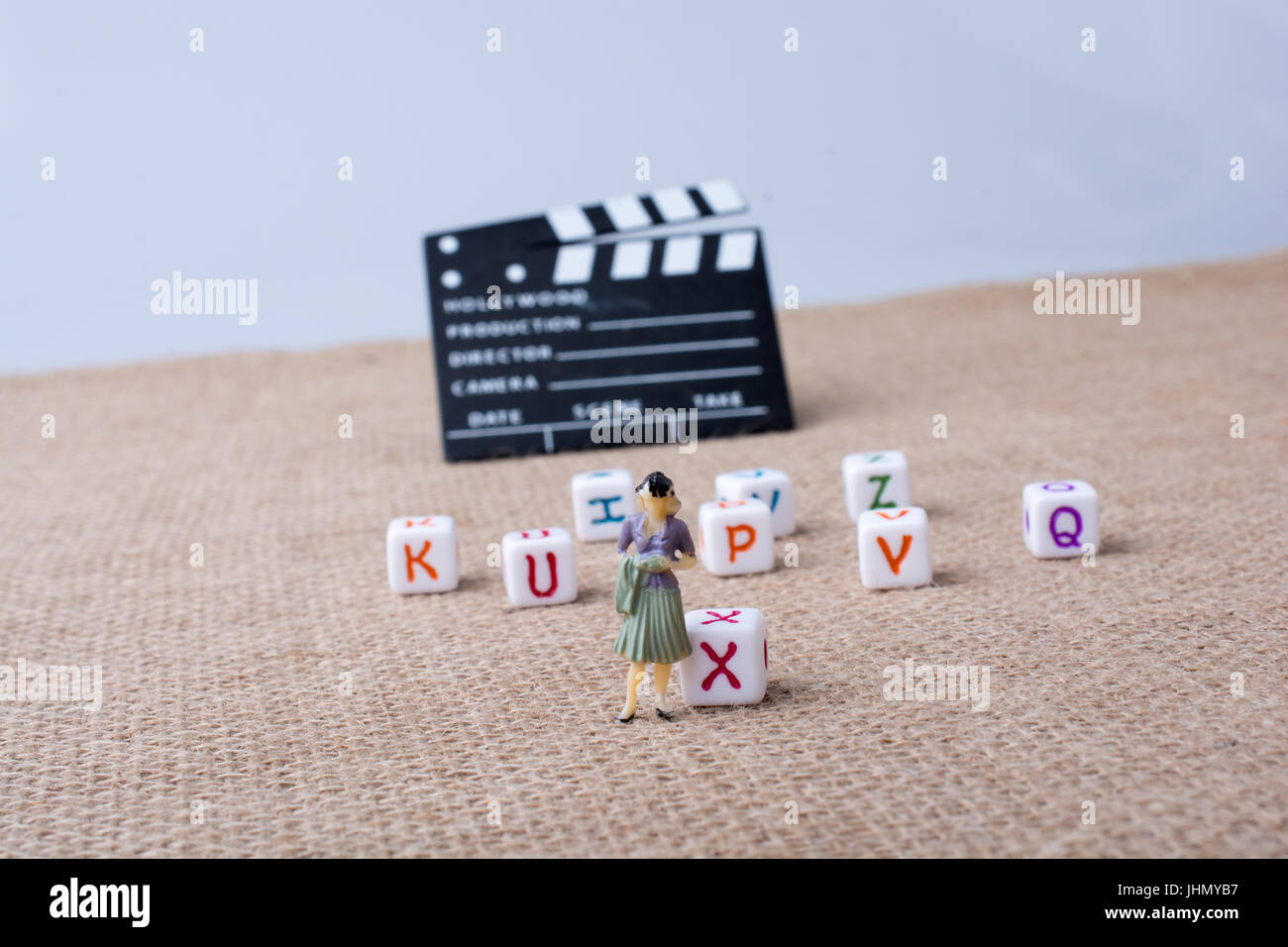 Colorful letter cubes beside a director clapper board Stock Photo - Alamy