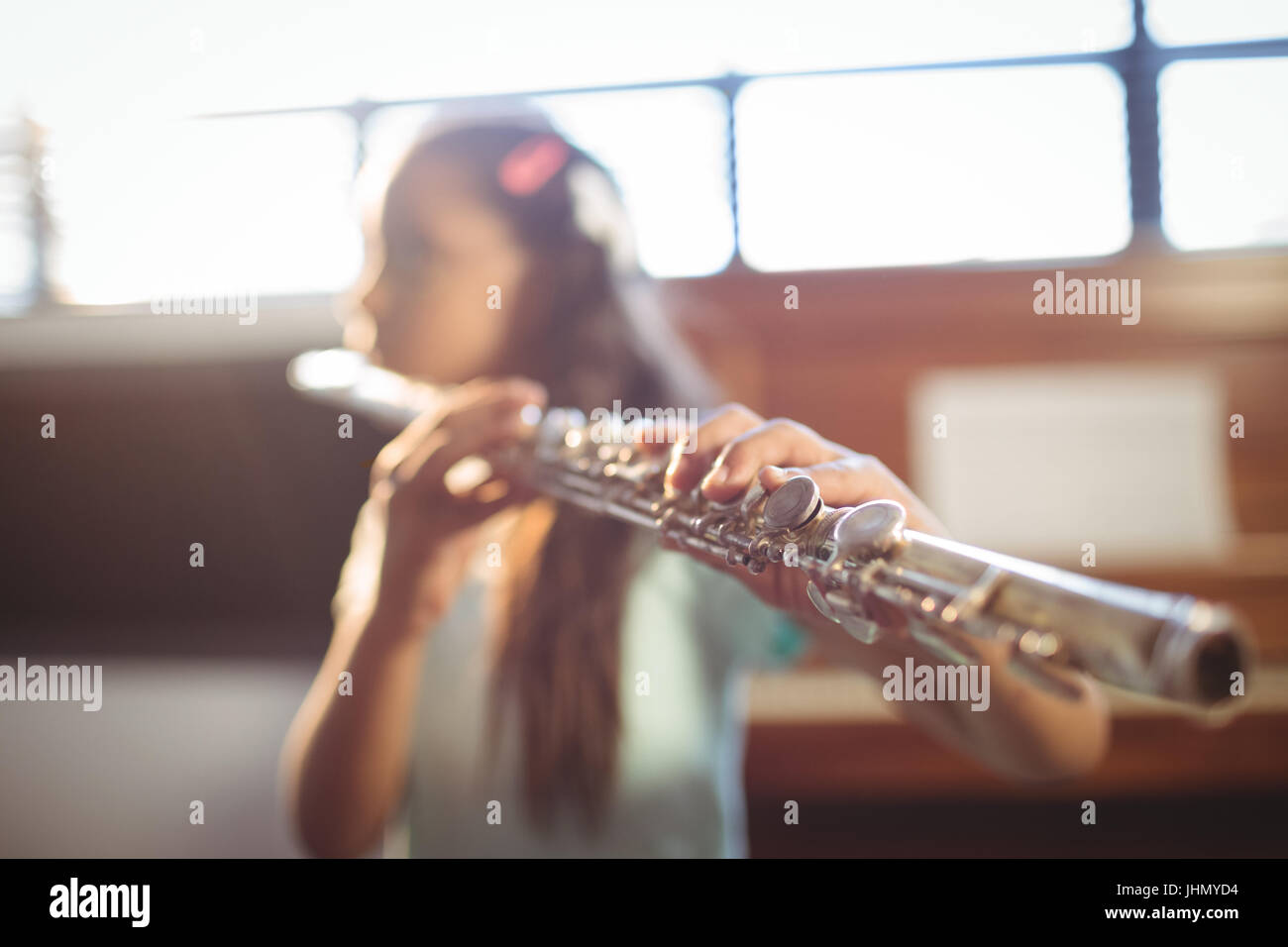 Girl practicing flute in classroom at music school Stock Photo - Alamy