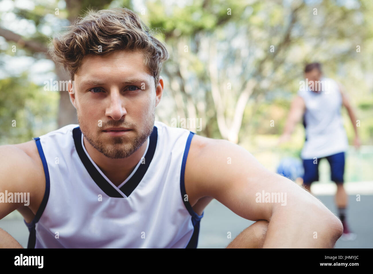 Young man playing around basketball hi-res stock photography and images ...
