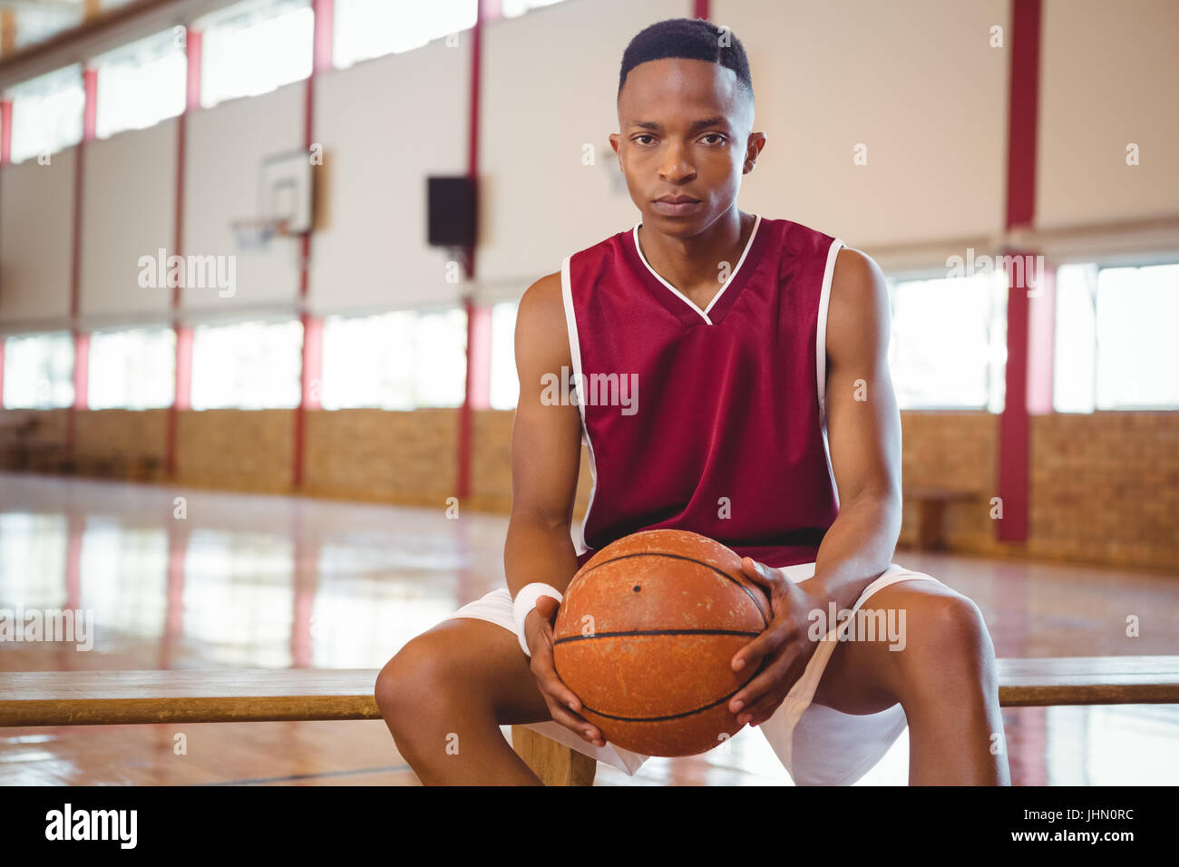 Portrait man sitting on basketball hi-res stock photography and images ...
