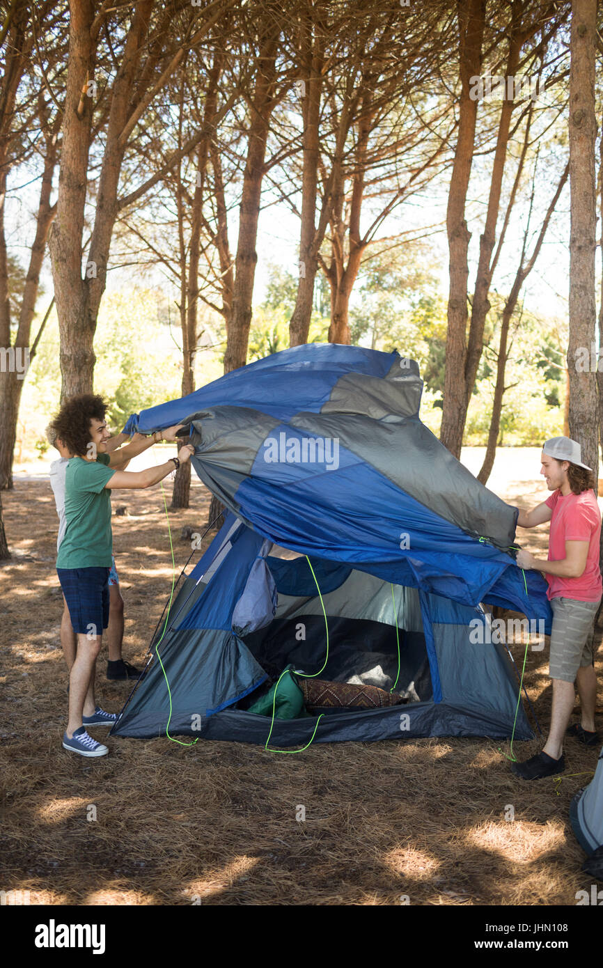 Smiling friend hike tent camping hi-res stock photography and images ...