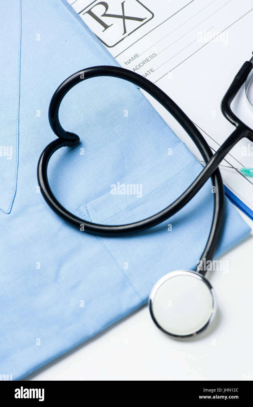 - A stethoscope in a shape of heart lying on a doctor uniform Stock ...