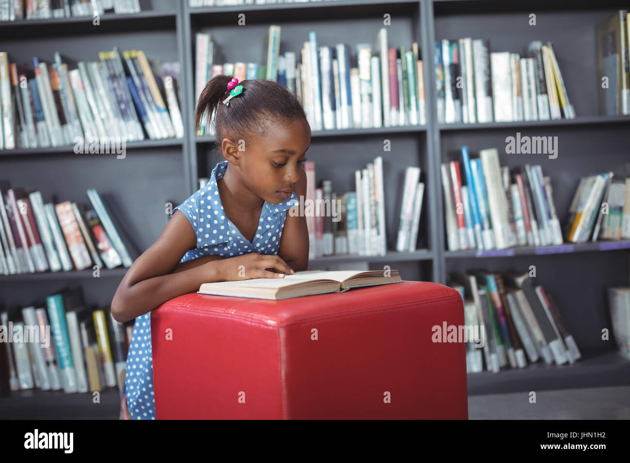 African girl reading library book hi-res stock photography and images ...