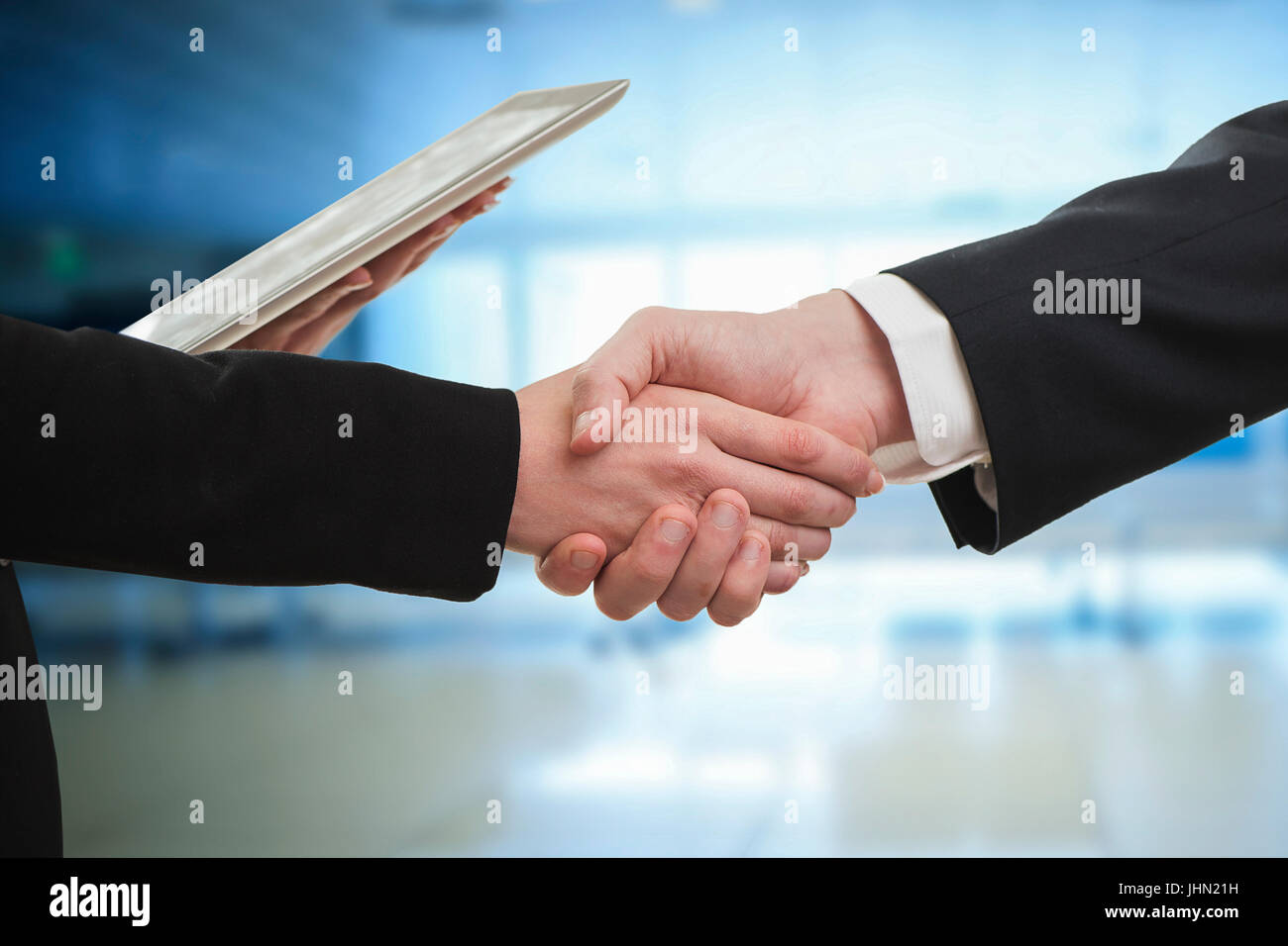 Two businessman shaking hands Stock Photo - Alamy