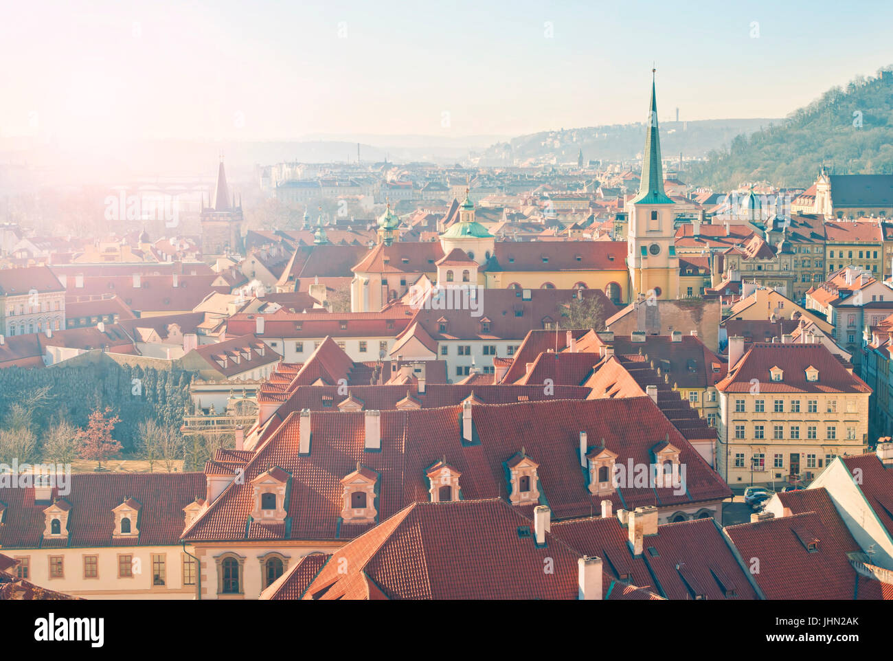 cross-processed view of Prague in early morning with sun lighting ...