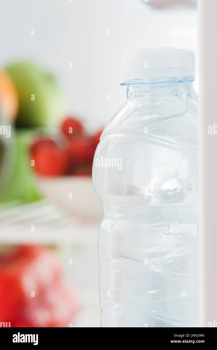 Bottles of cold and refreshing mineral water in refrigerator Stock ...