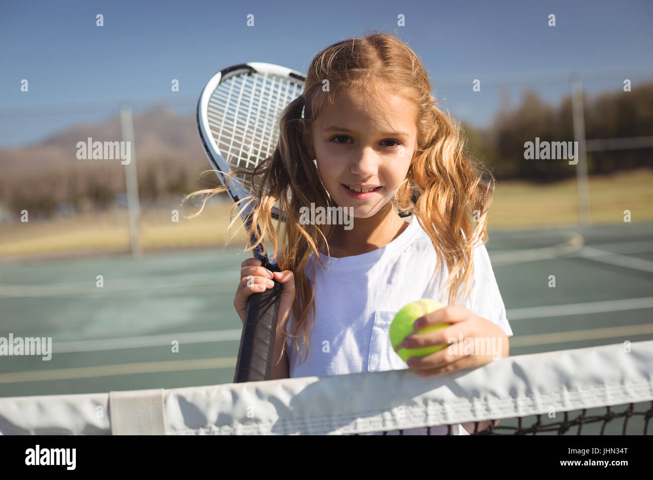Girl holding tennis racket hi-res stock photography and images - Alamy