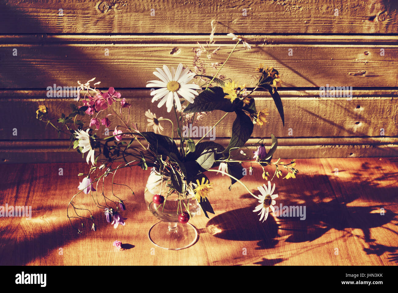 Bouquet of the wildflowers in the interior. Retro effect Stock Photo ...