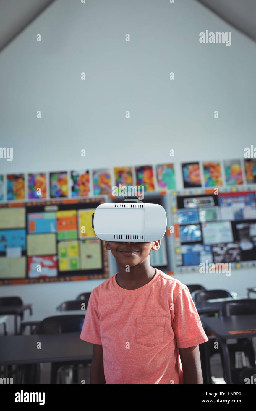 Boy wearing virtual reality simulator in classroom Stock Photo - Alamy