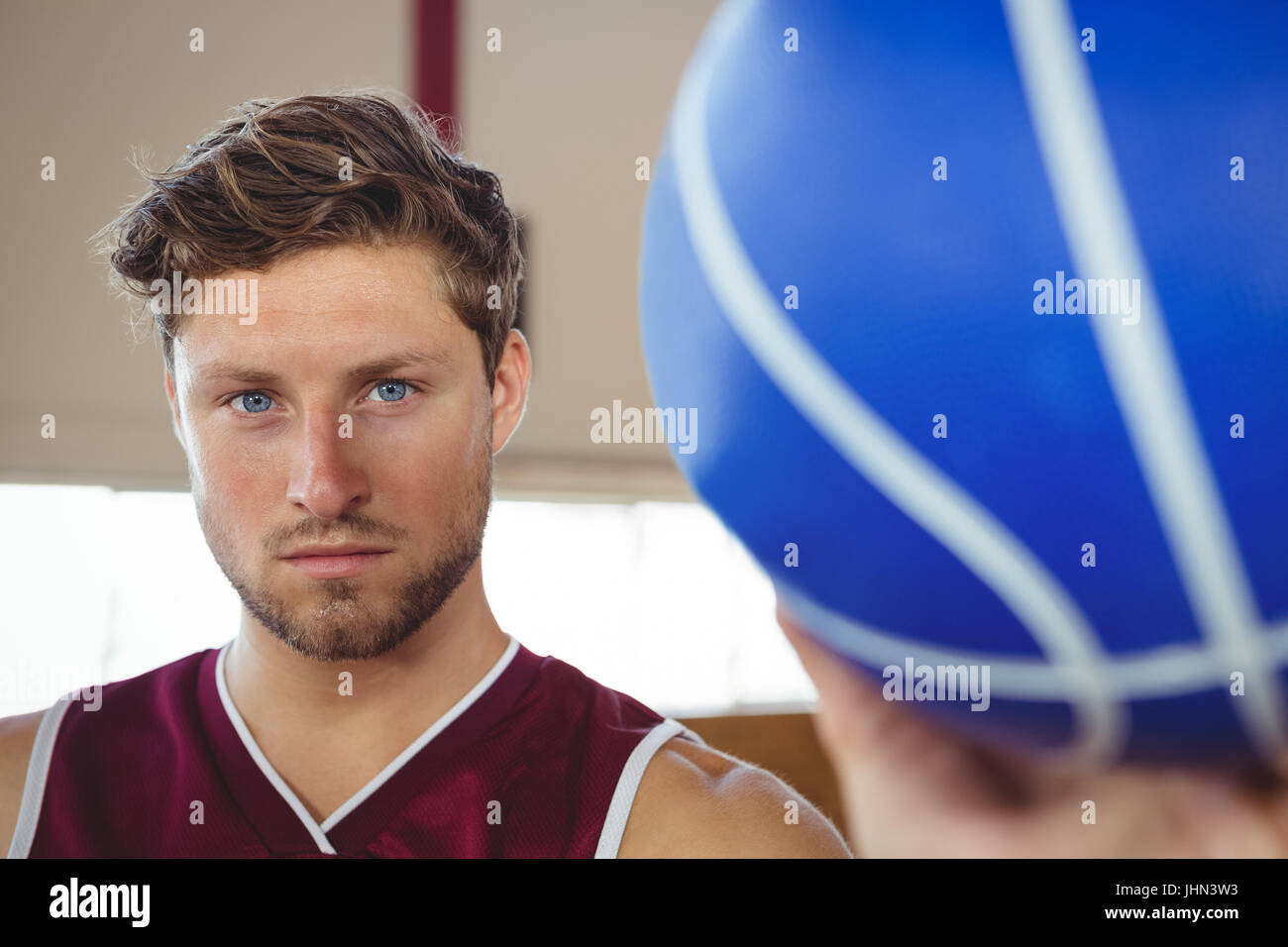 Serious basketball player holding hi-res stock photography and images ...