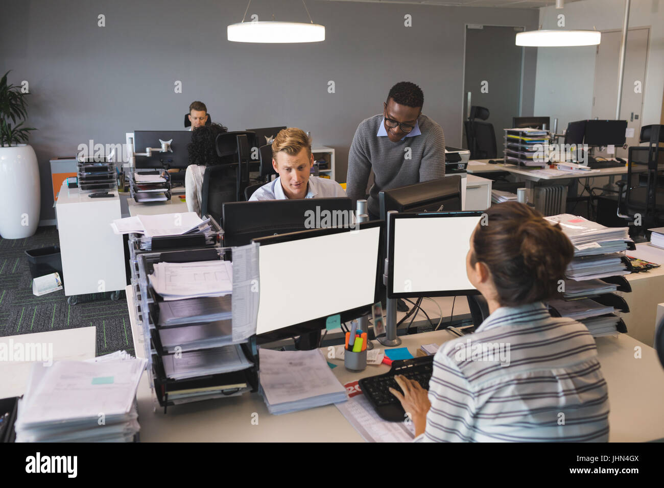 Office staff work on computers hi-res stock photography and images - Alamy