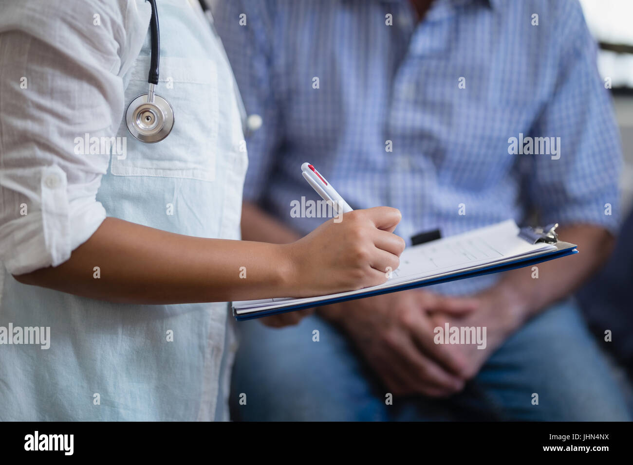 Therapist writing in medical hi-res stock photography and images - Alamy