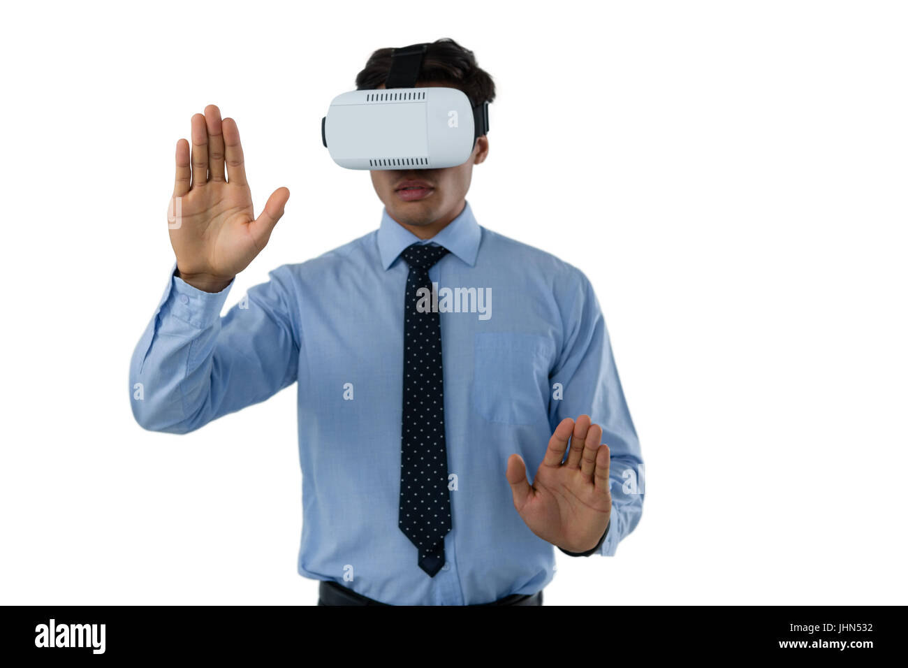 Businessman wearing vr glasses while using invisible interface against ...