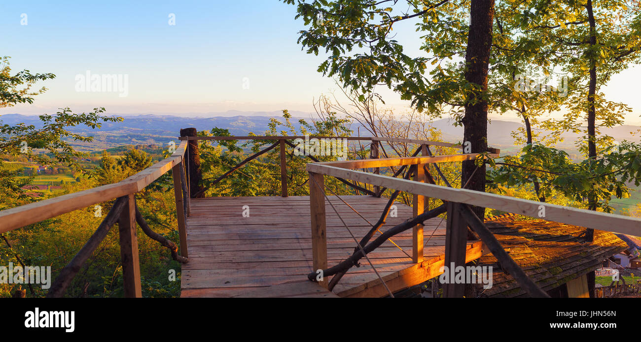 View on nature from a wooden forest terrace Stock Photo - Alamy