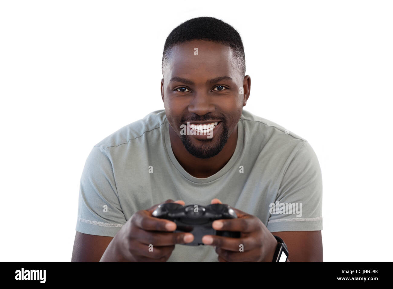 Man with a joystick against white background Stock Photo - Alamy