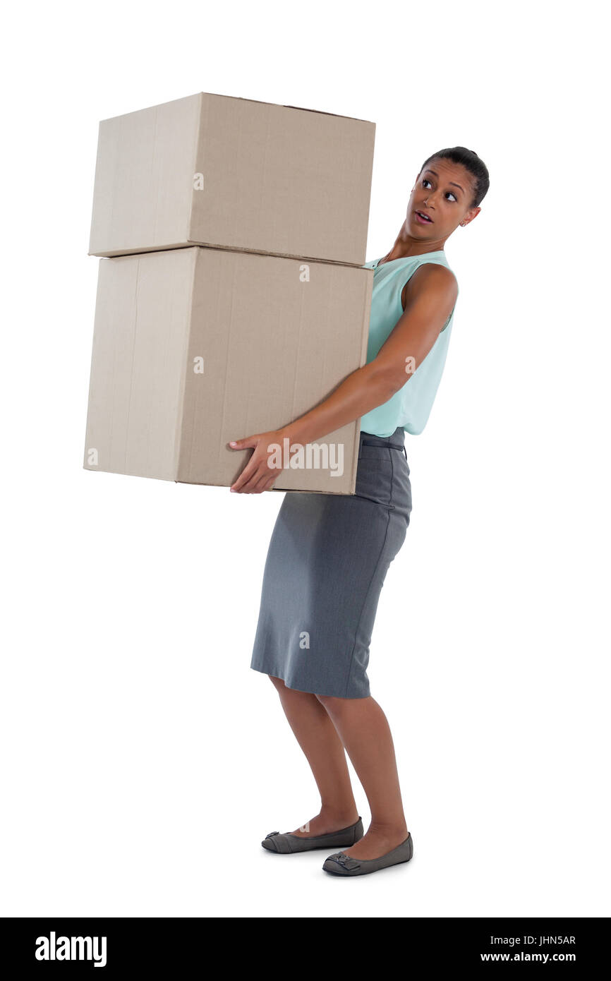 Woman carrying heavy boxes hi-res stock photography and images - Alamy