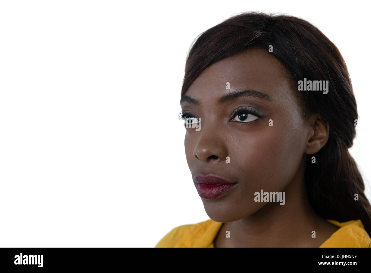 Close up of contemplated young woman against white background Stock ...