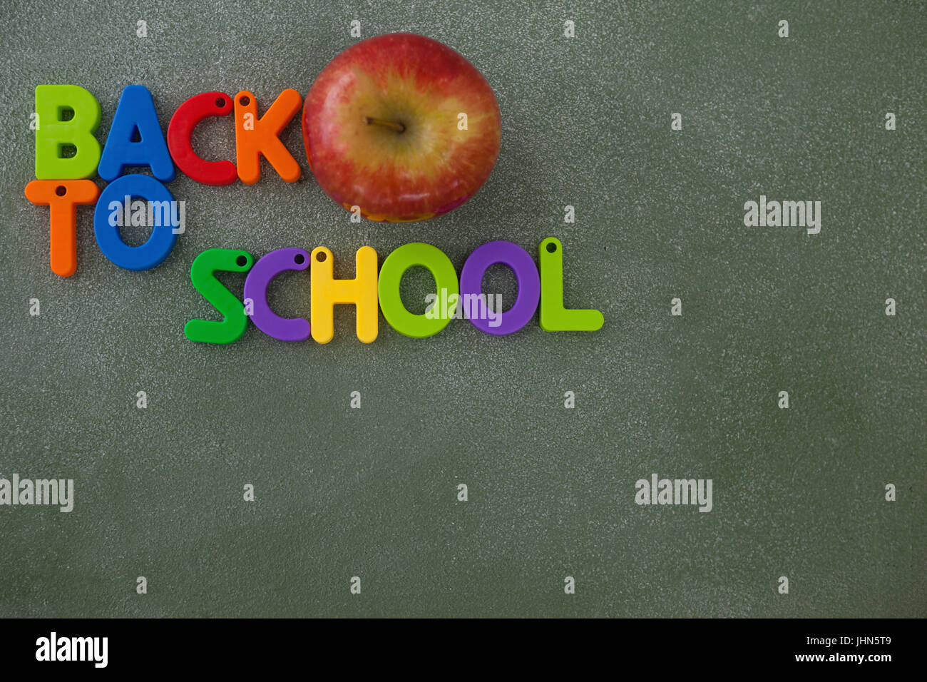 Close-up of block letters and apple arranged on chalkboard Stock Photo ...