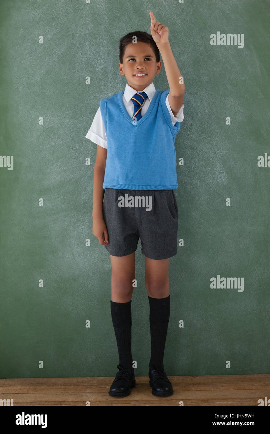 School class raised hand uniform hi-res stock photography and images ...