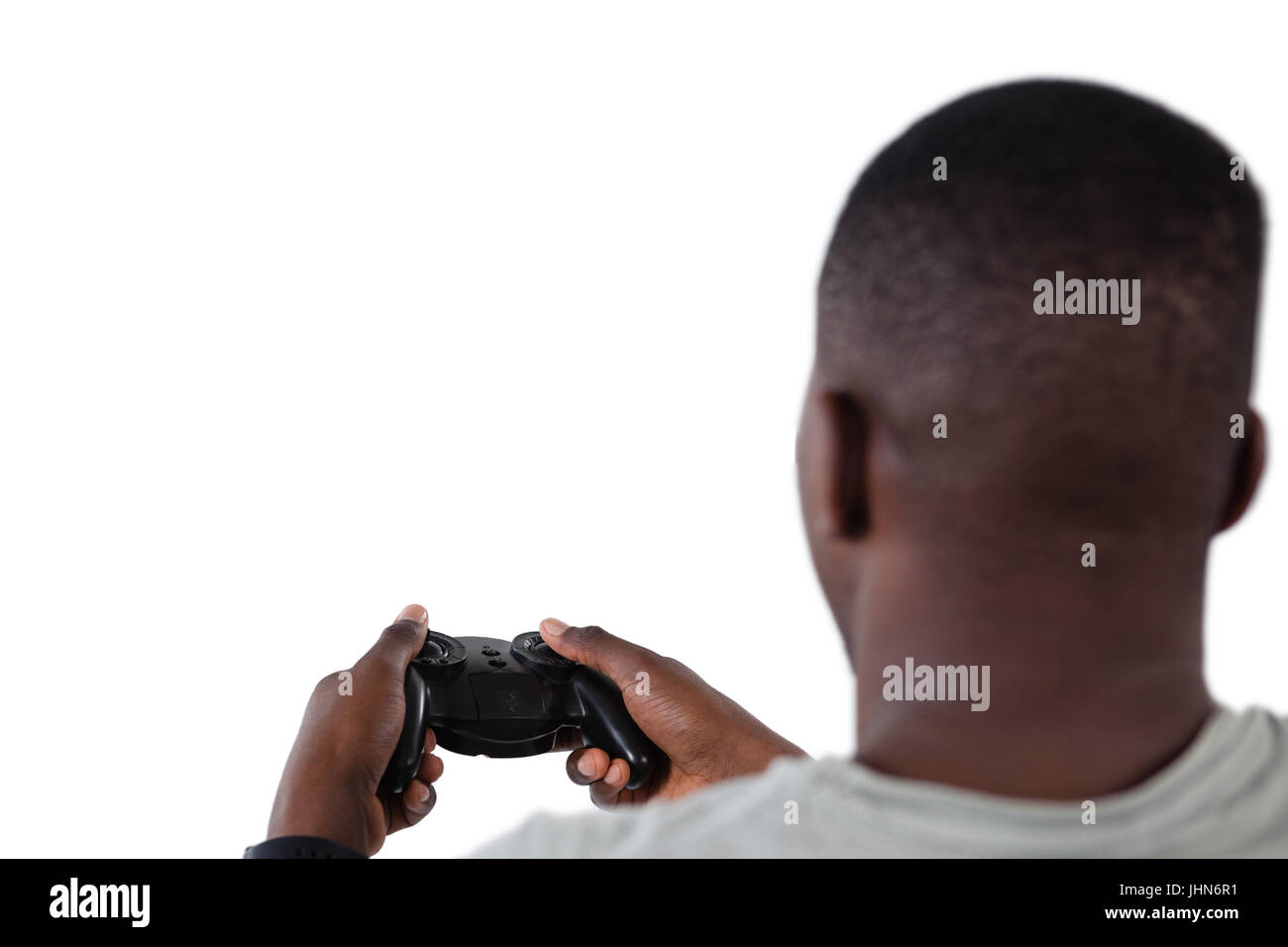 Close-up of man playing video game against white background Stock Photo ...