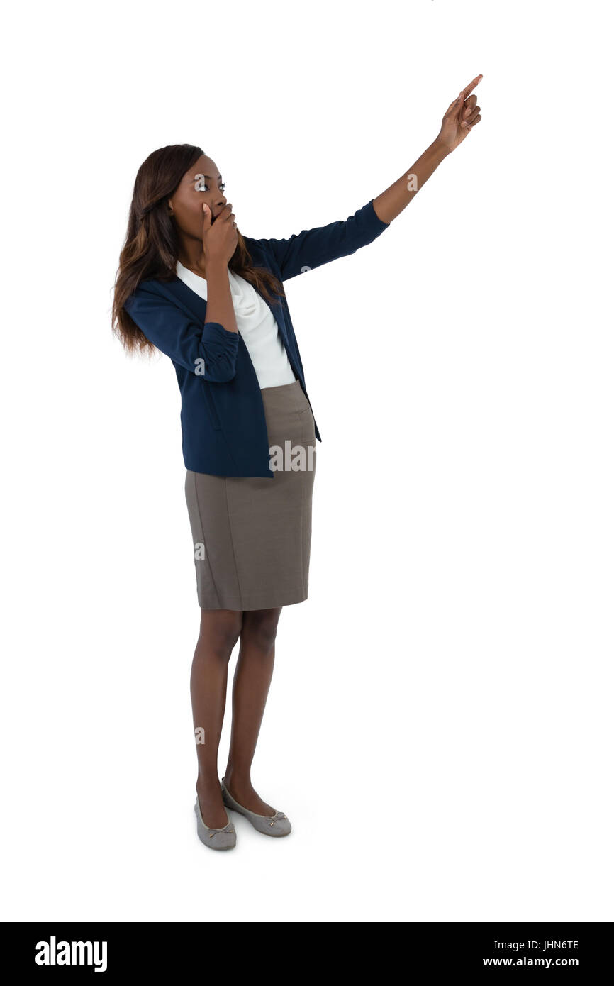 Full length of businesswoman giving presentation while standing against ...