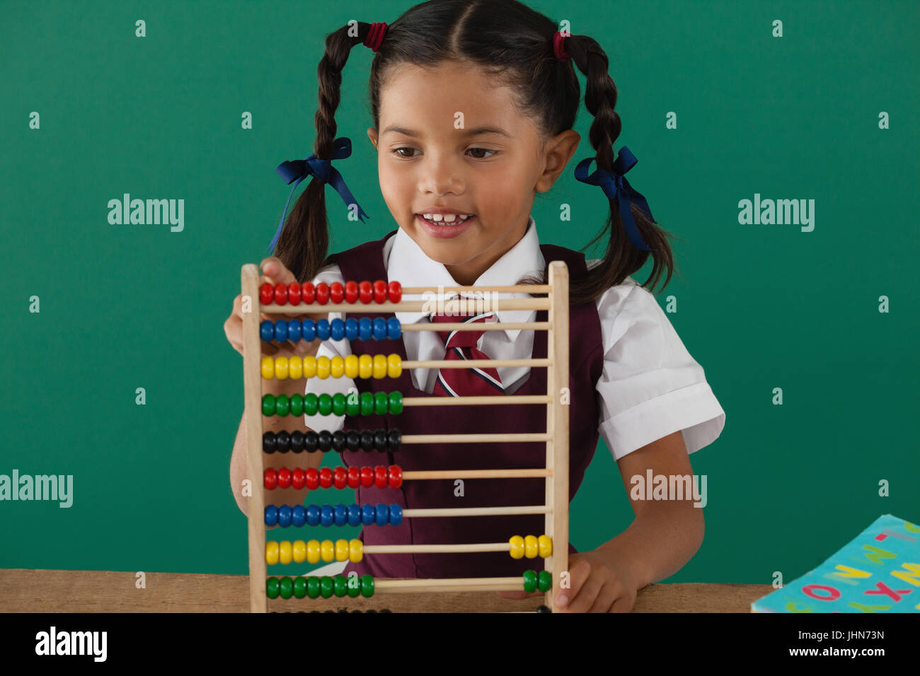 Learning school uniform abacus hi-res stock photography and images - Alamy