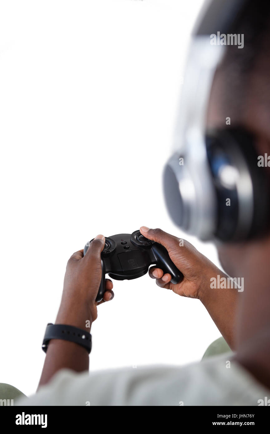 Close-up of man playing video game against white background Stock Photo ...