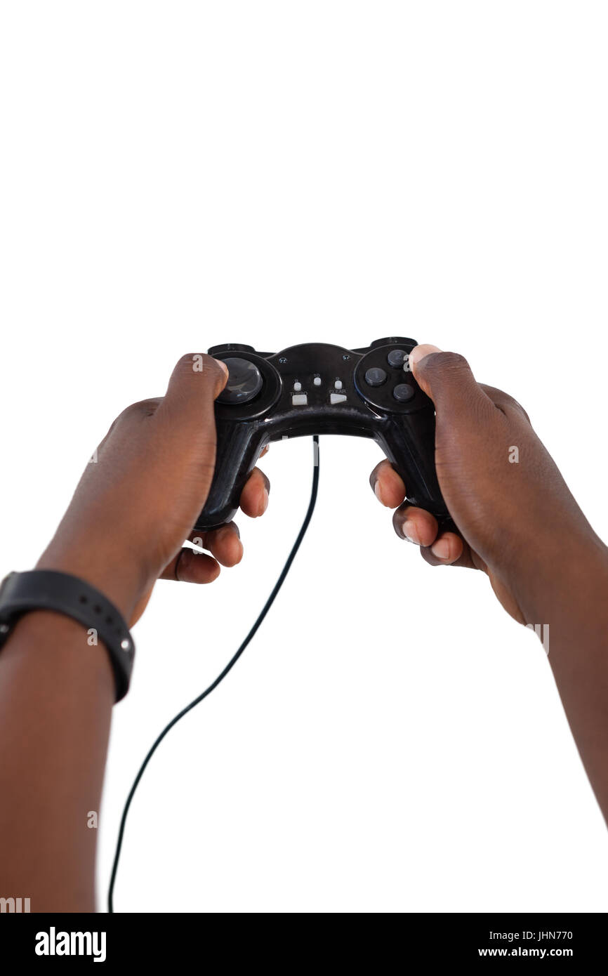 Close-up of mans hand playing video game against white background Stock ...