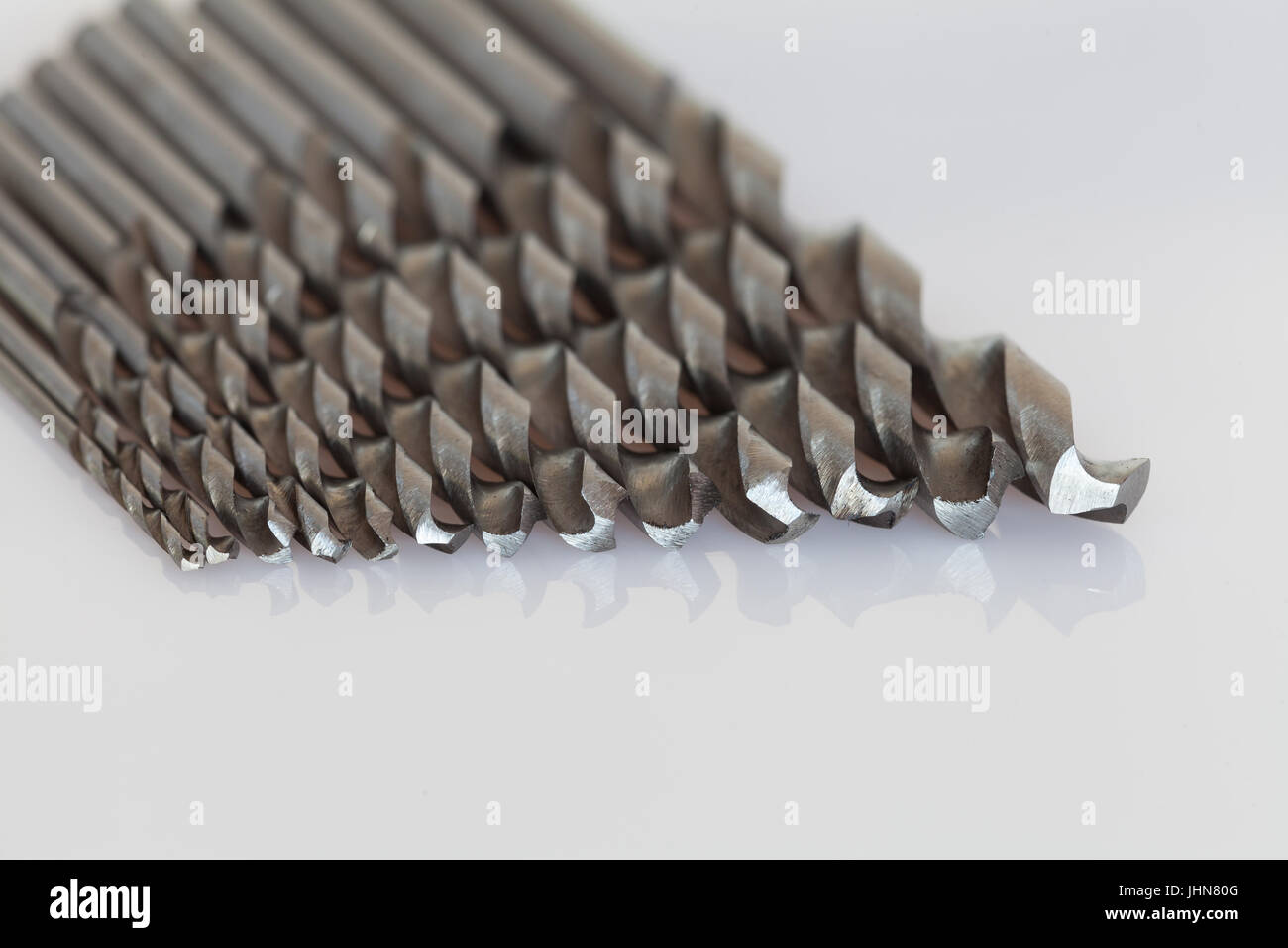 Drill bits isolated on white background Stock Photo - Alamy