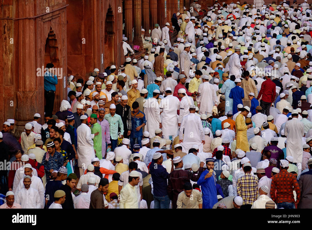 Crowd of lots of Muslim people praying namaz on occasion of Eid-Al-Fitr at old Delhi Mosque jama ...