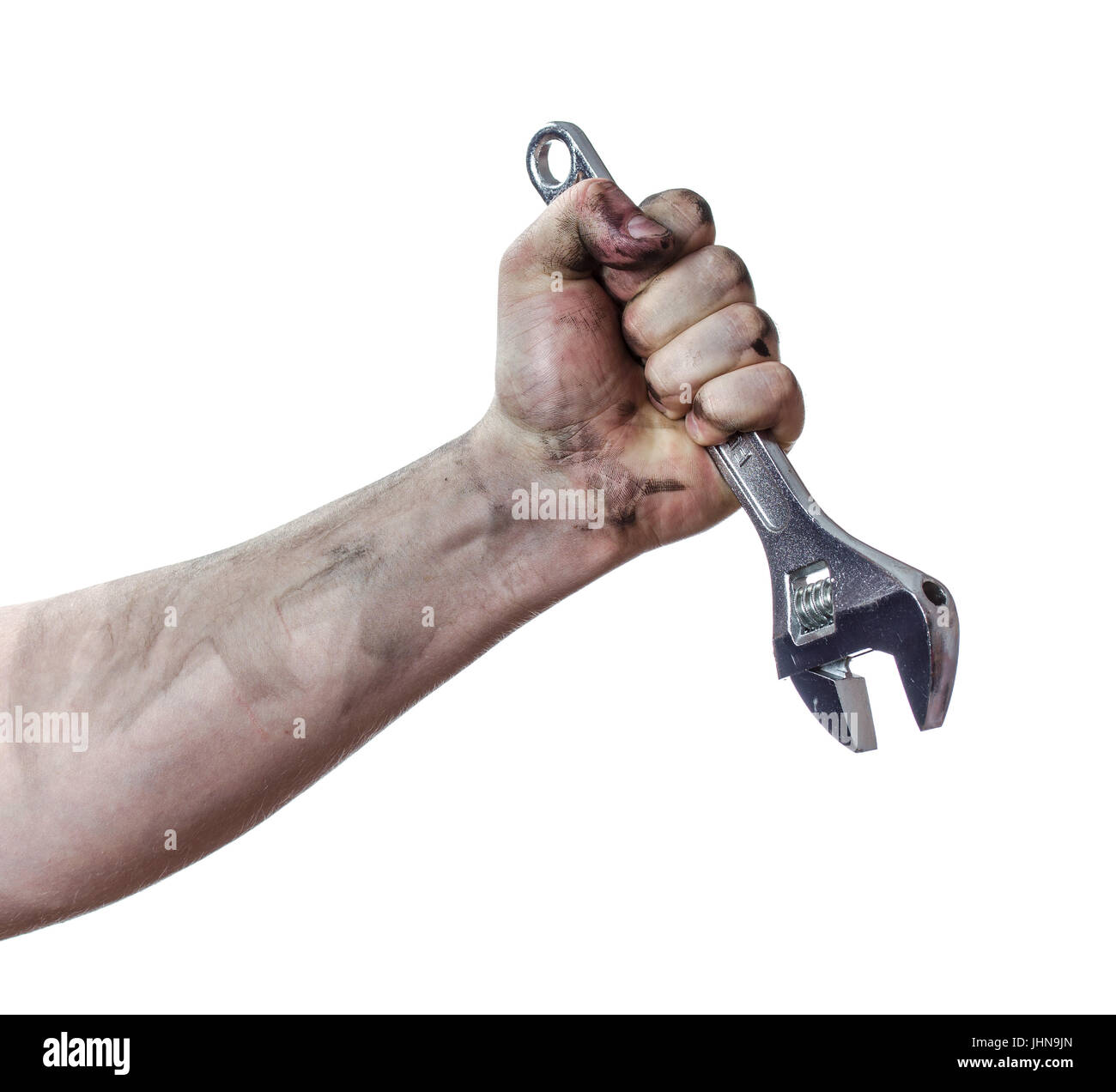 Oily hands of mechanic holding a wrench. Isolated background Stock ...