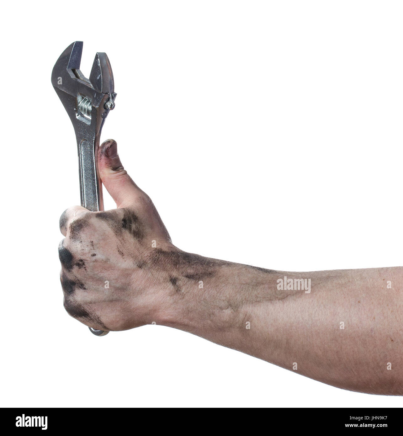 Oily hands of mechanic holding a wrench. Isolated background Stock ...