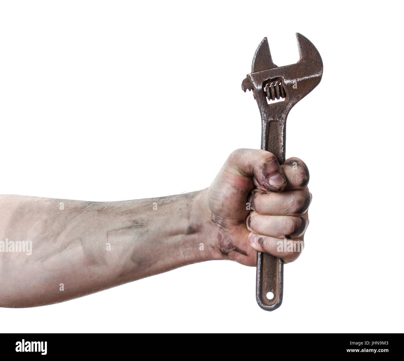 Oily hands of mechanic holding a wrench. Isolated background Stock ...