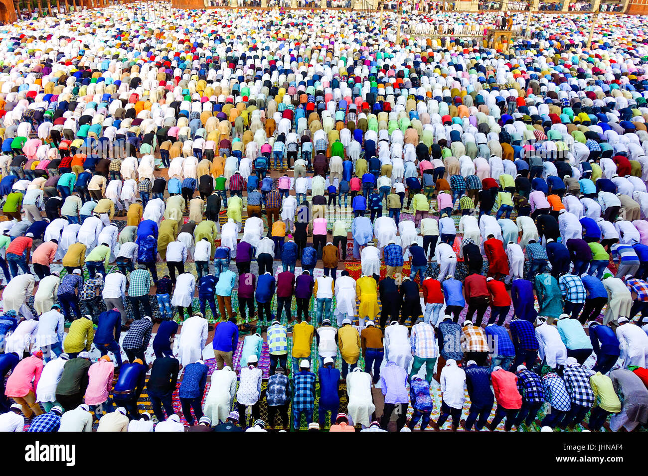 Crowd of lots of Muslim people praying namaz on occasion of Eid-Al-Fitr at old Delhi Mosque jama ...