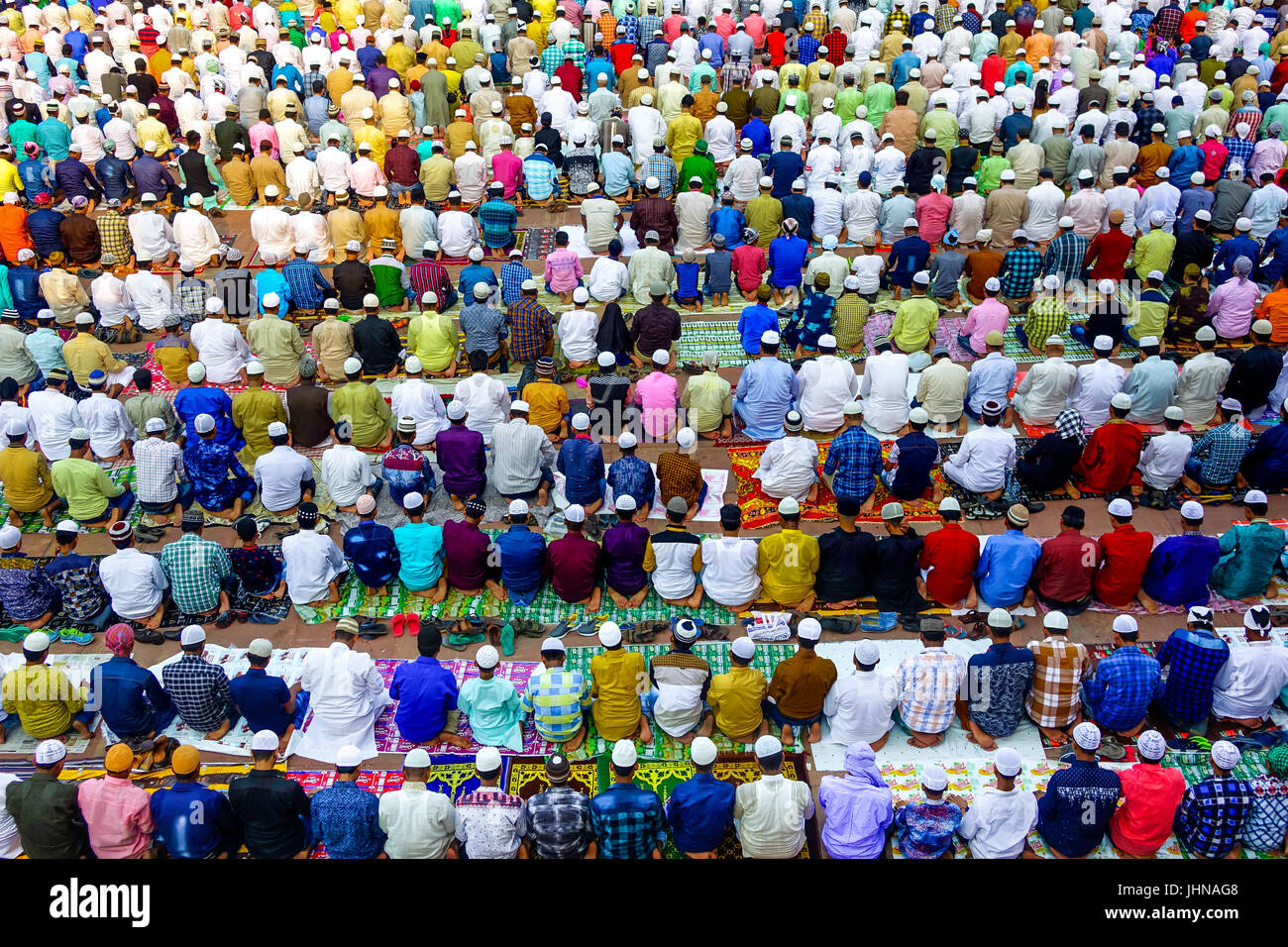 Crowd of lots of Muslim people praying namaz on occasion of Eid-Al-Fitr ...