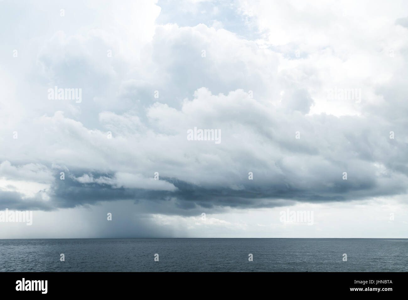 Dark clouds in open ocean Stock Photo - Alamy