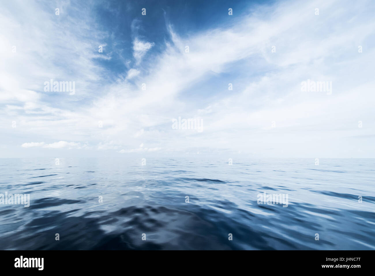Open ocean and cloudy sky Stock Photo - Alamy