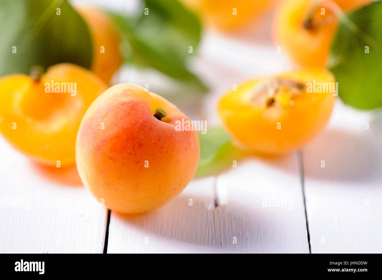 Apricot fruir on white table Stock Photo - Alamy