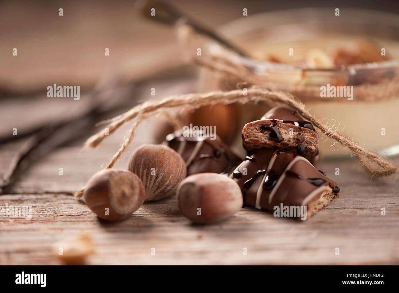 chocolate hazelnuts on wooden table background Stock Photo - Alamy
