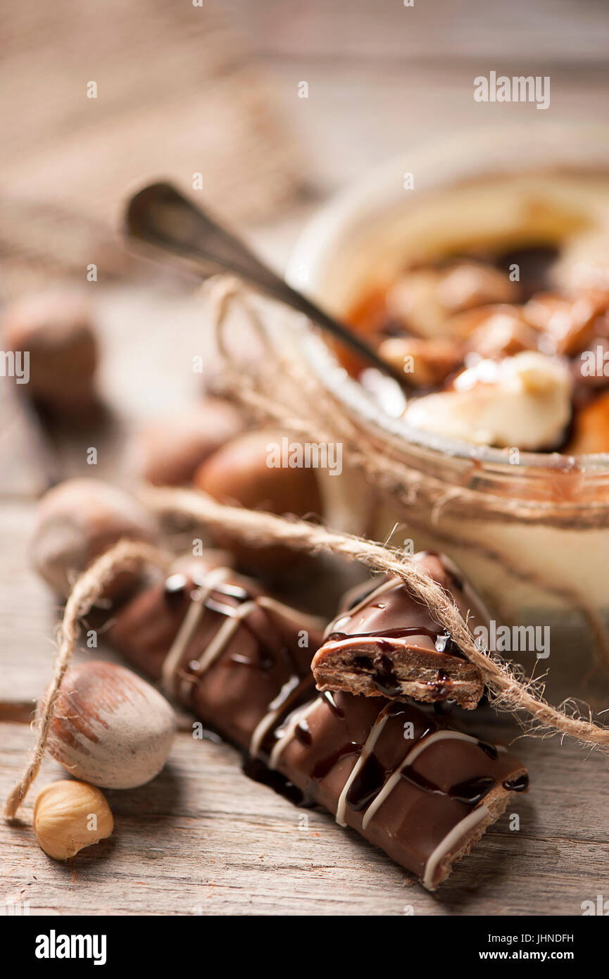 chocolate hazelnuts on wooden table background Stock Photo - Alamy