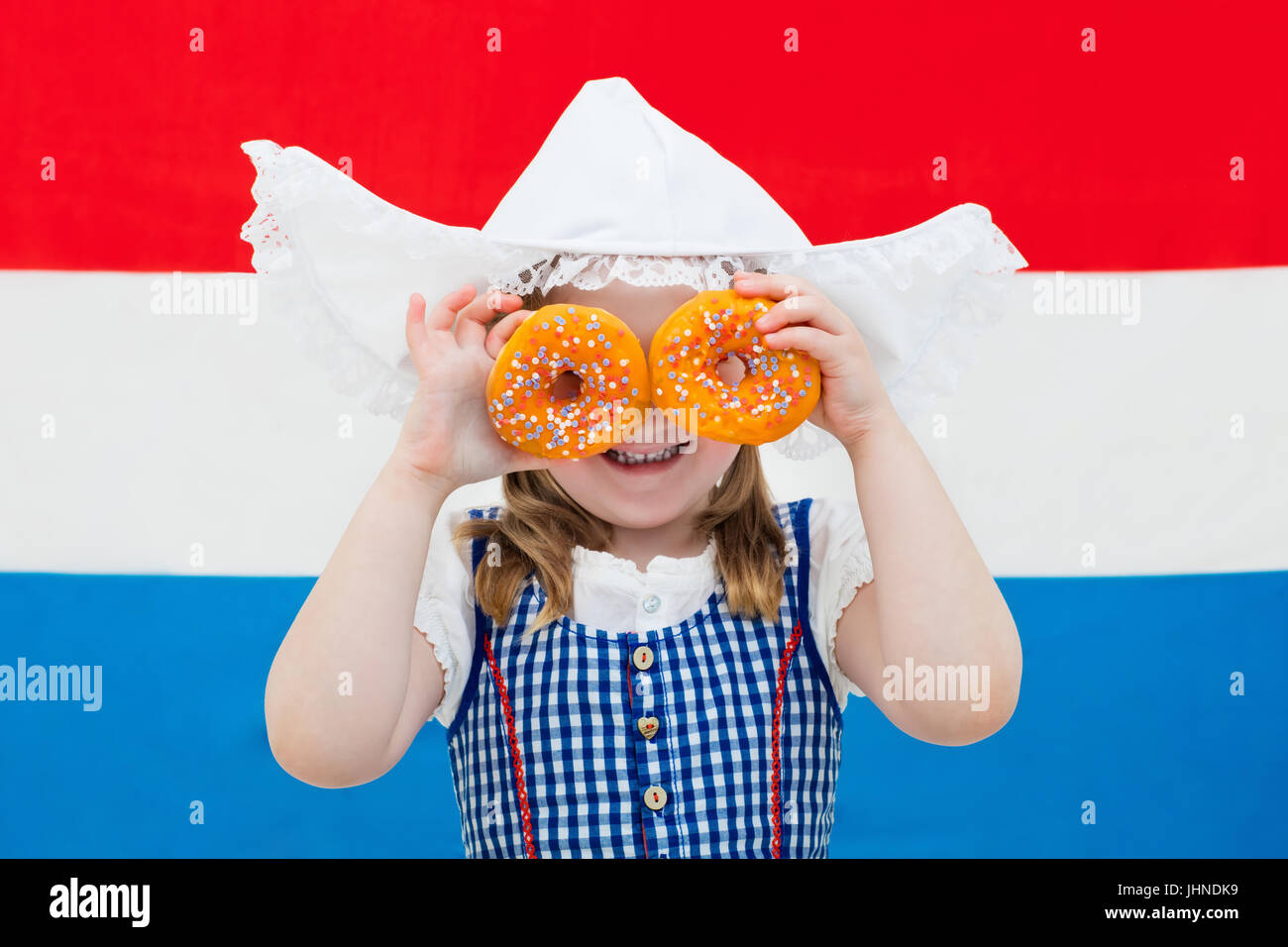 Little Dutch girl wearing traditional national costume, dress and hat ...